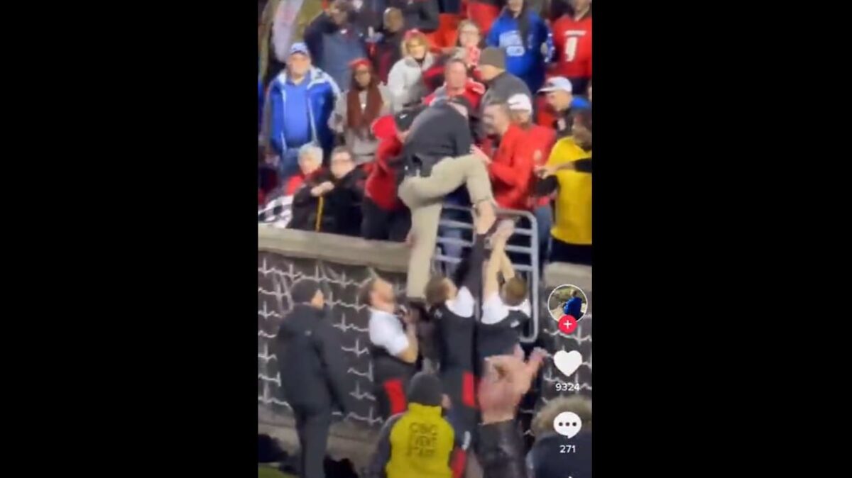 UL Cheerleaders Hoist Cop Into the Crowd to Stop Fight